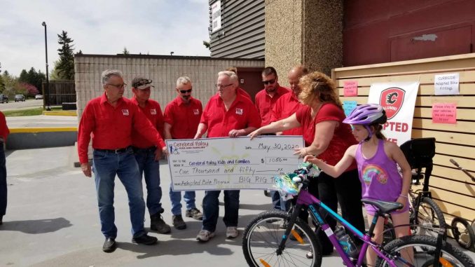 Calgary big rigs tow in donation for Adaptive Bike program benefitting ...