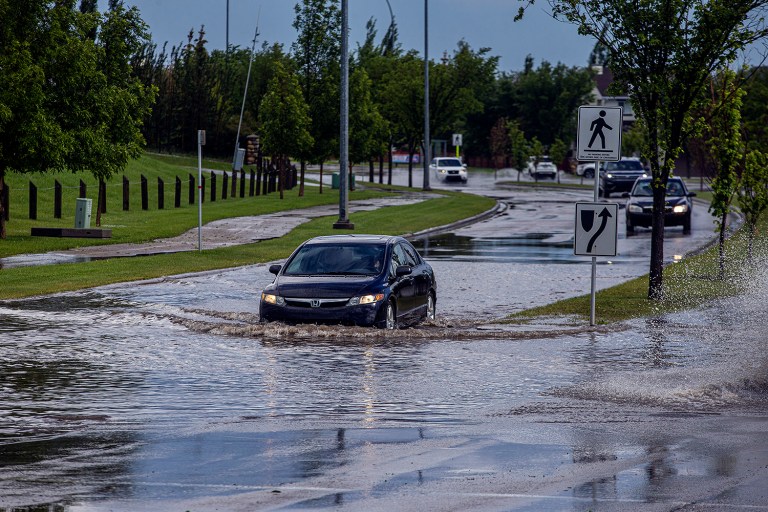 Photos: Heavy rainfall causes storm flooding in northwest Calgary ...