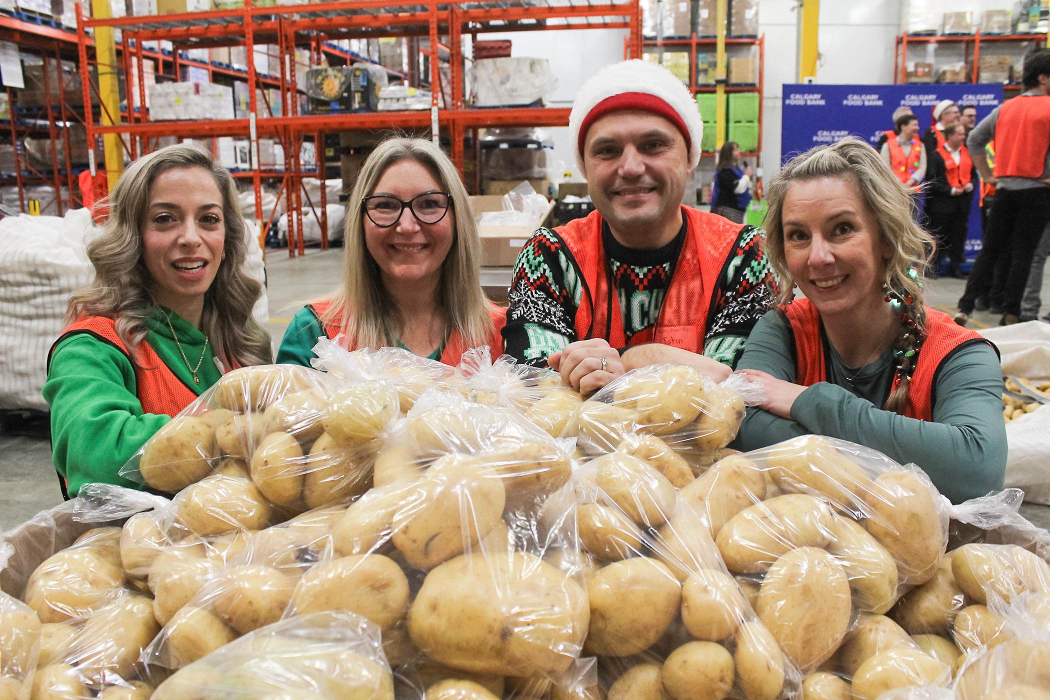 Sacked: Councillors compete to bag potatoes in Calgary food bank ...